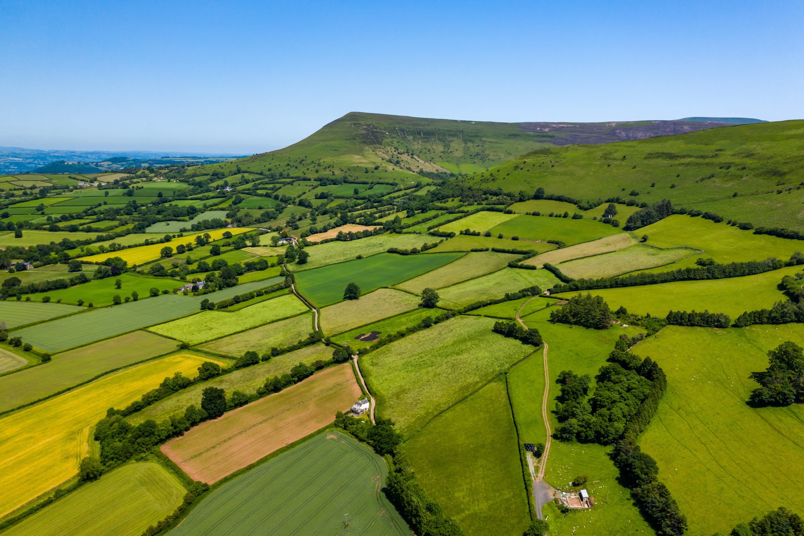 Aerial view of green fields and farmlands in rural Wales - UK ...